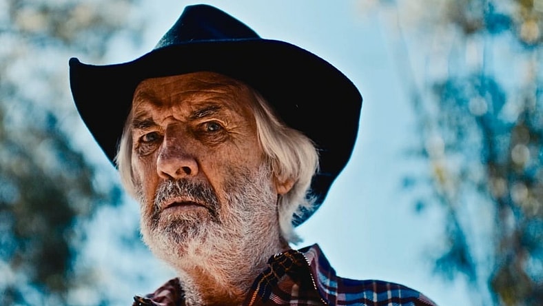 'Wolf Creek's John Jarratt Slashes Into 'Shed'